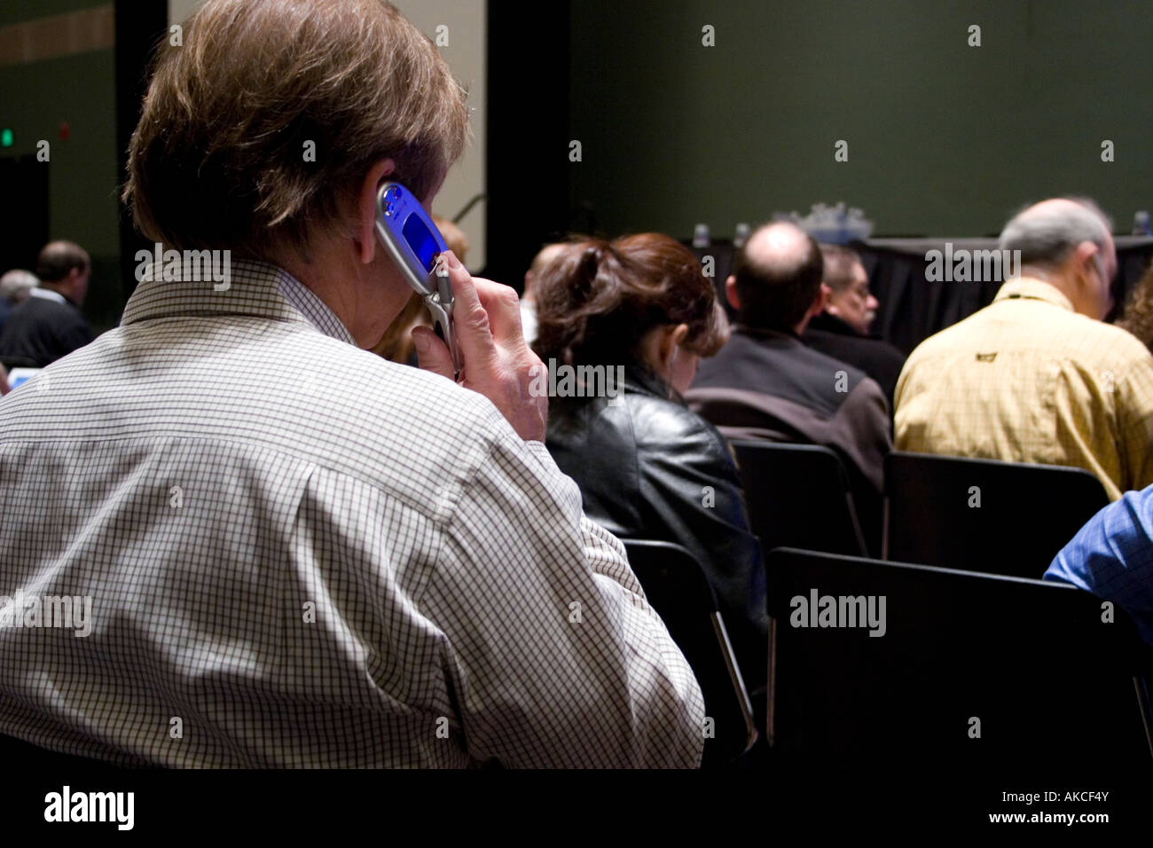 Man making cell mobile phone call in Theater Stock Photo - Alamy
