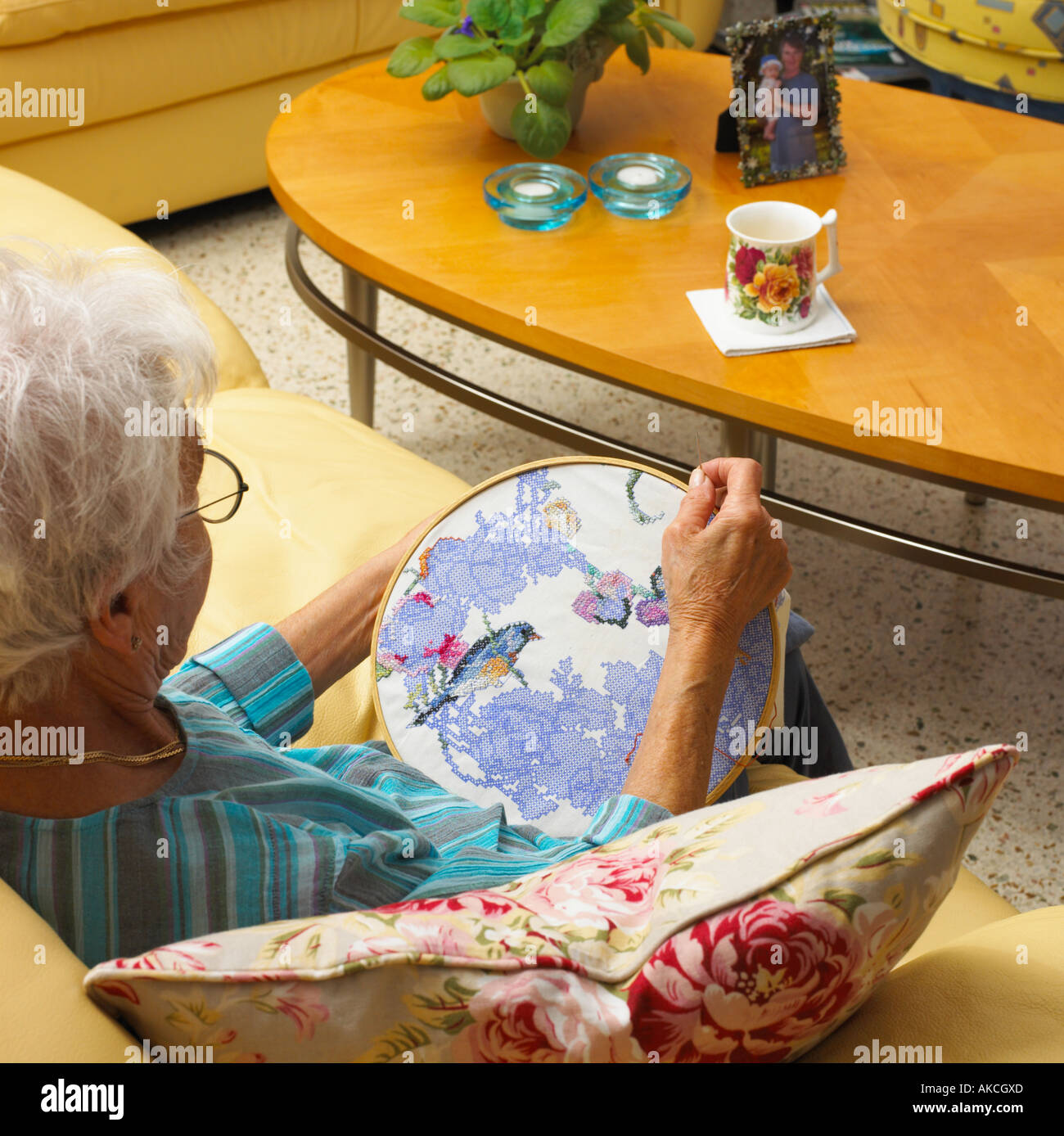 Mature woman with needlepoint Stock Photo - Alamy