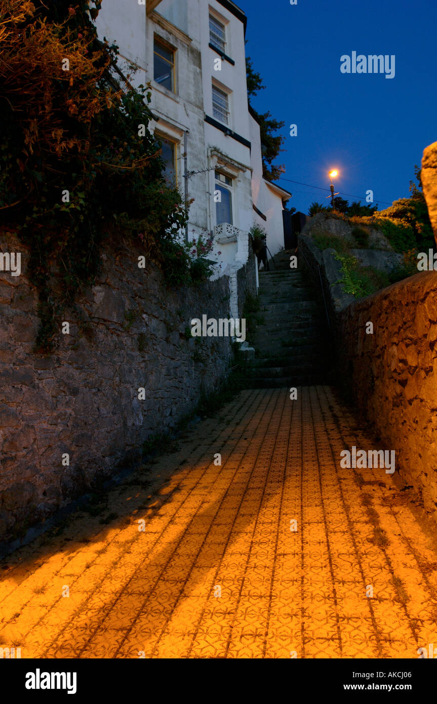 Illuminated alley and steps at night Stock Photo - Alamy