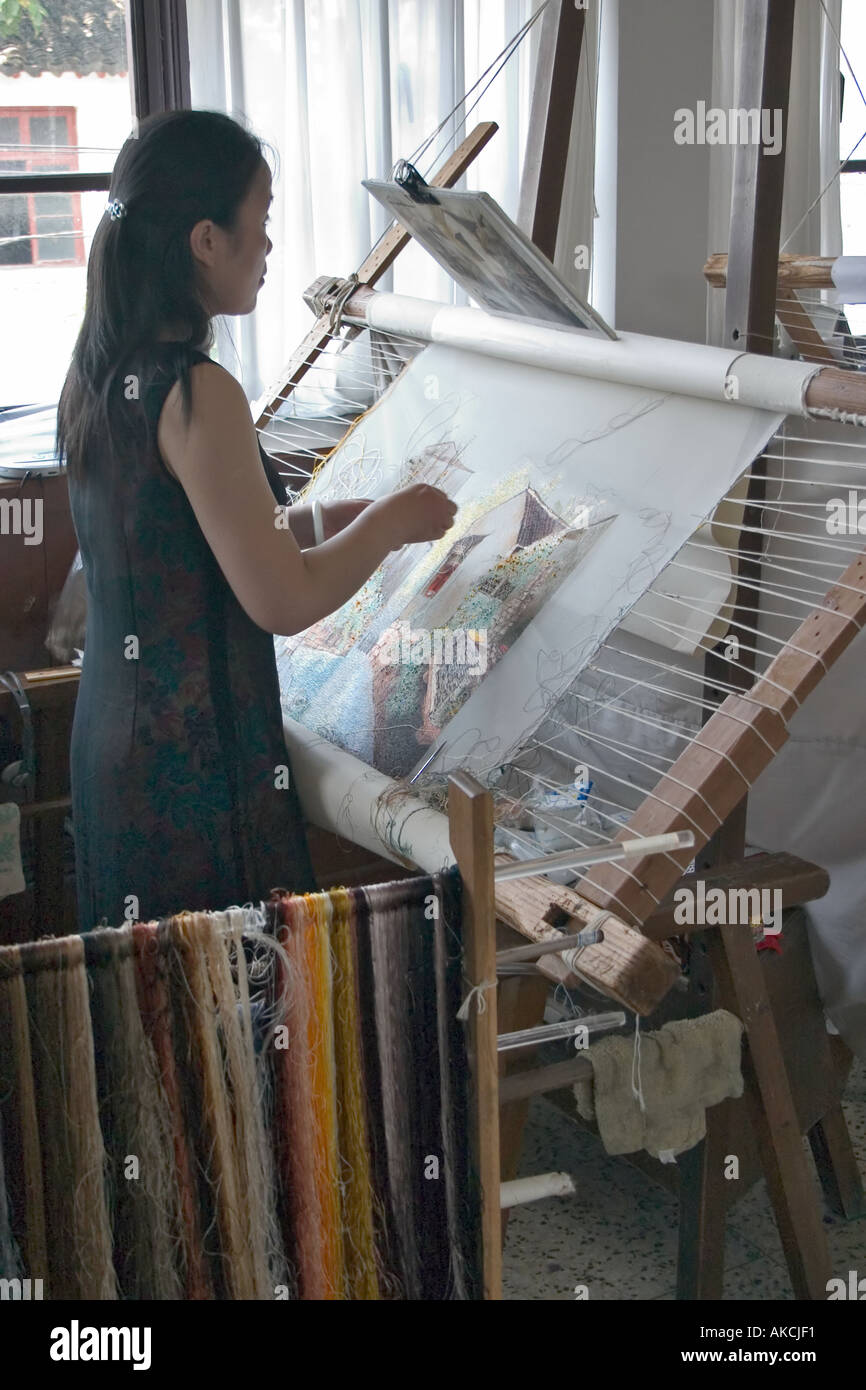 Lady sewing a slik picture Stock Photo - Alamy