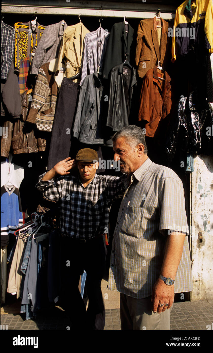 Two men standing outside of a clothing store Stock Photo - Alamy