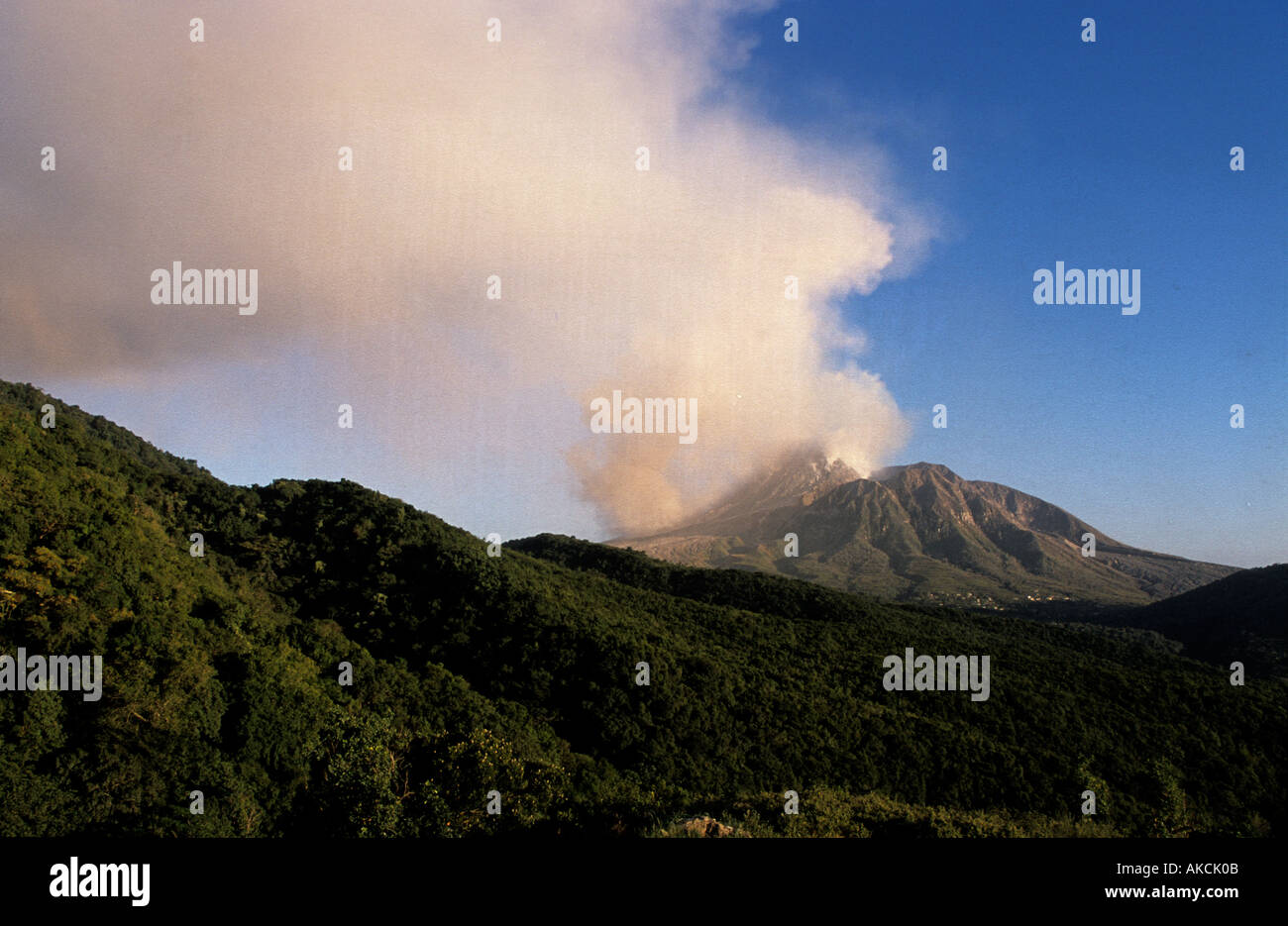Landscape with Soufrière Hills volcano erupting ash plumes, Montserrat ...