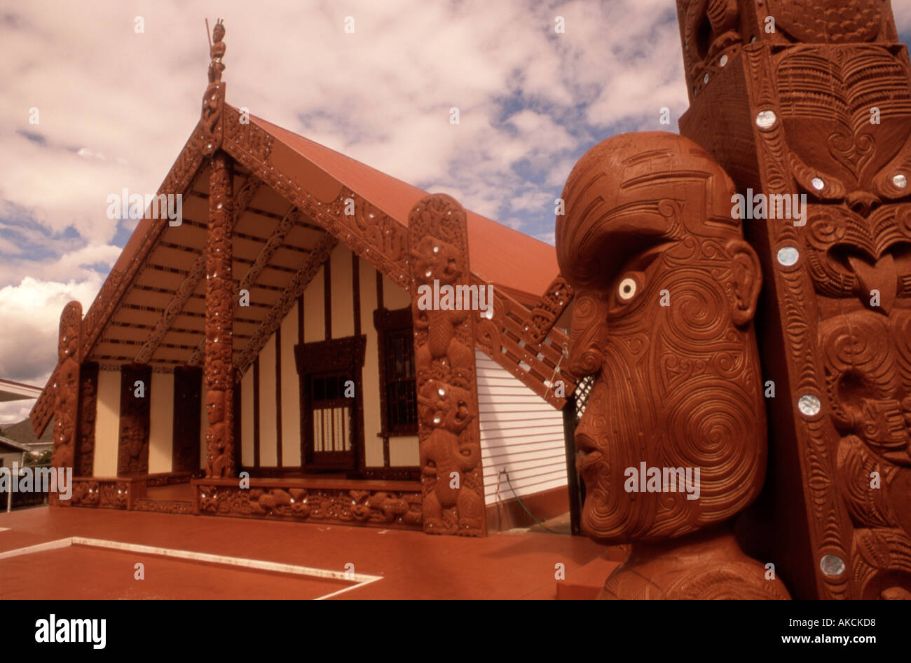 Traditional Maori whare meeting house showing traditional decoration ...