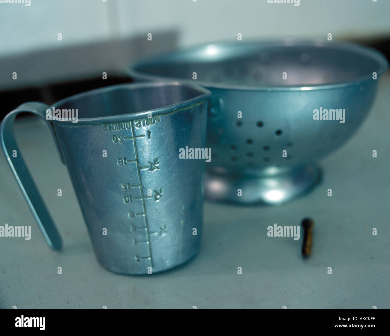 Traditional measuring jug and cullender with pint measurements Stock ...