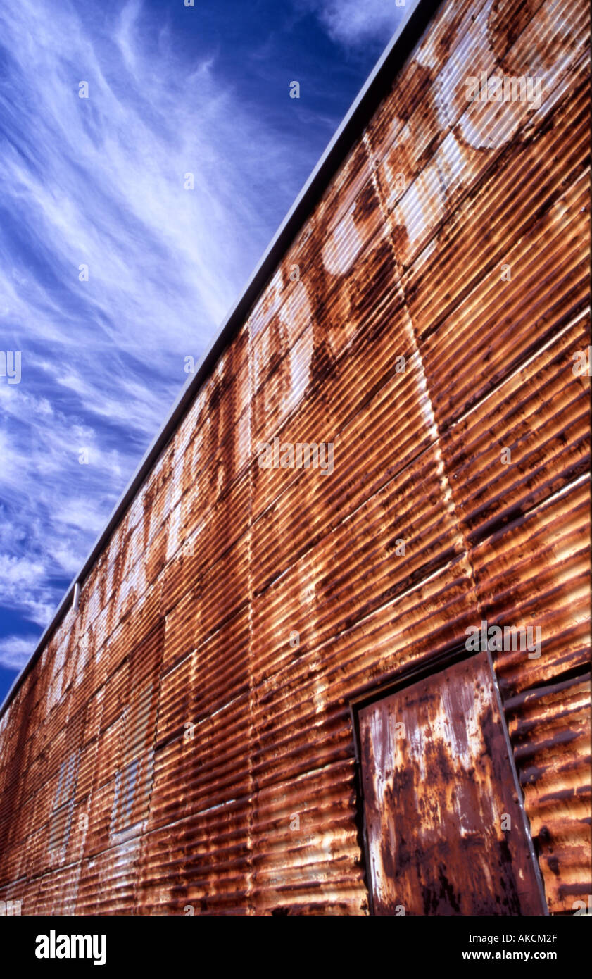 Old warehouse with rusting corrugated iron wall Stock Photo - Alamy