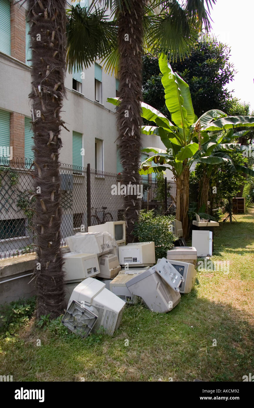 Pile of computer monitors in yard of apartment house on the island of ...