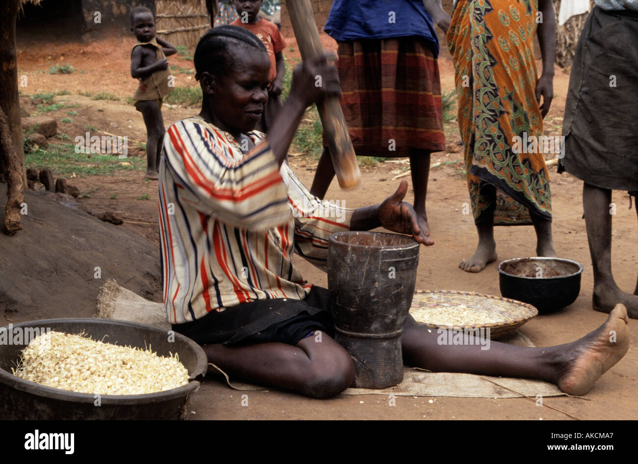 Pounding maize hi-res stock photography and images - Alamy