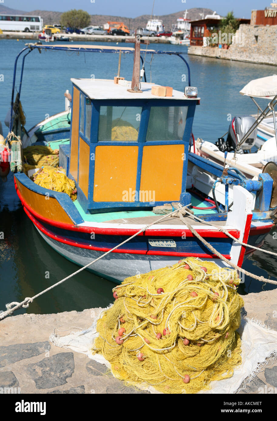 A Greek fishing boat with its nets tied up in Elounda harbour Crete ...