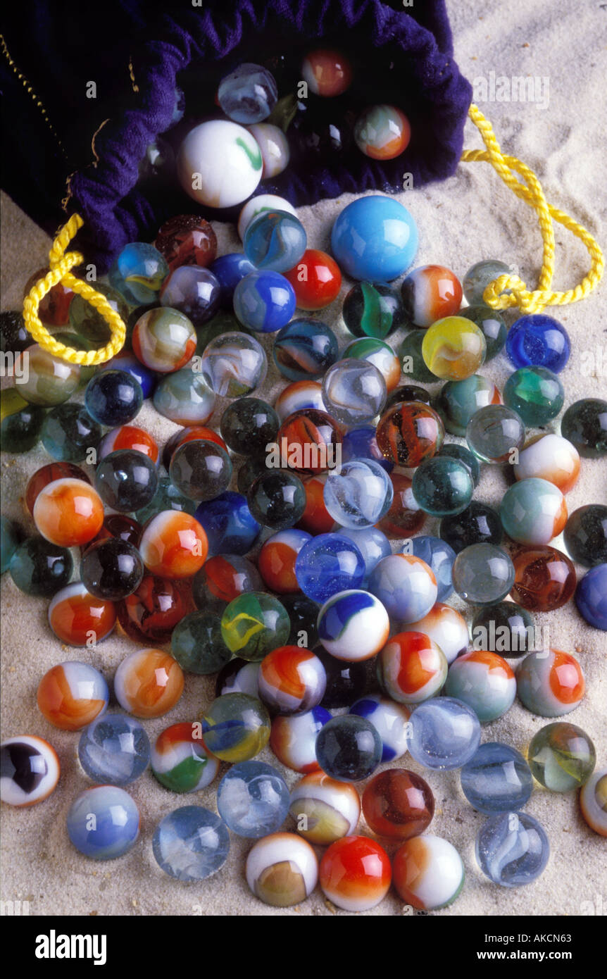Bag of marbles spilling out Stock Photo - Alamy