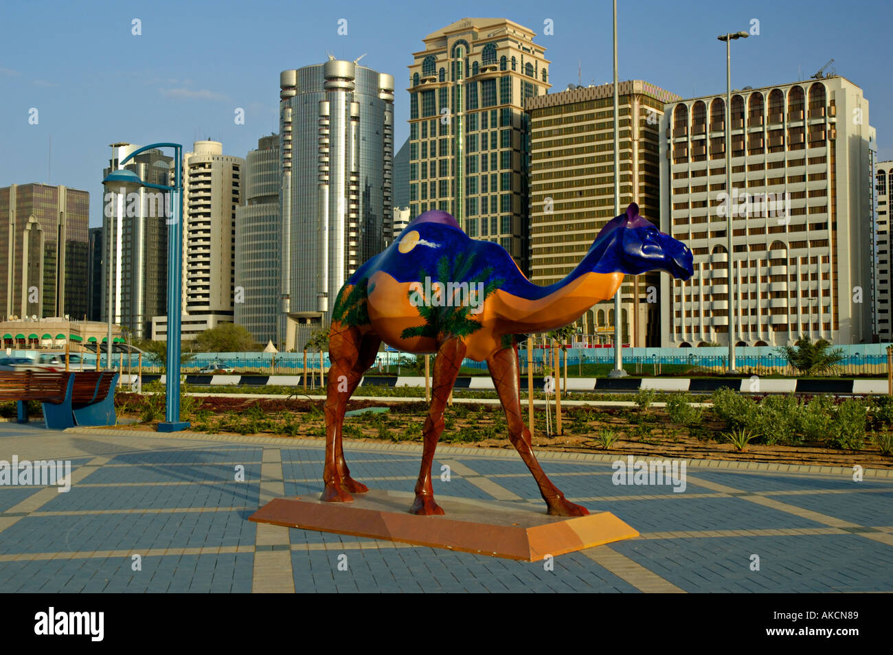 Camel and futuristic high rise buildings on the Corniche Abu Dhabi UAE ...