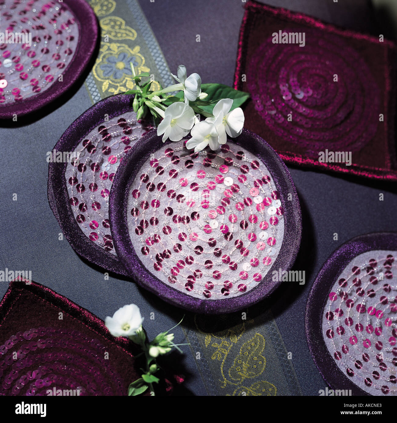 silk coasters with white flowers Stock Photo - Alamy