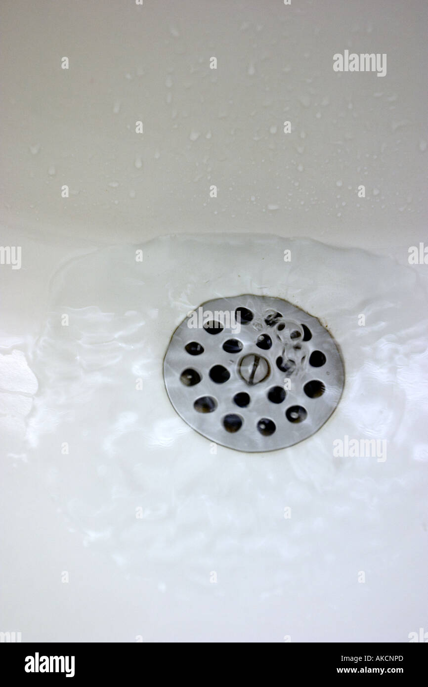 water running down a plug hole Stock Photo - Alamy