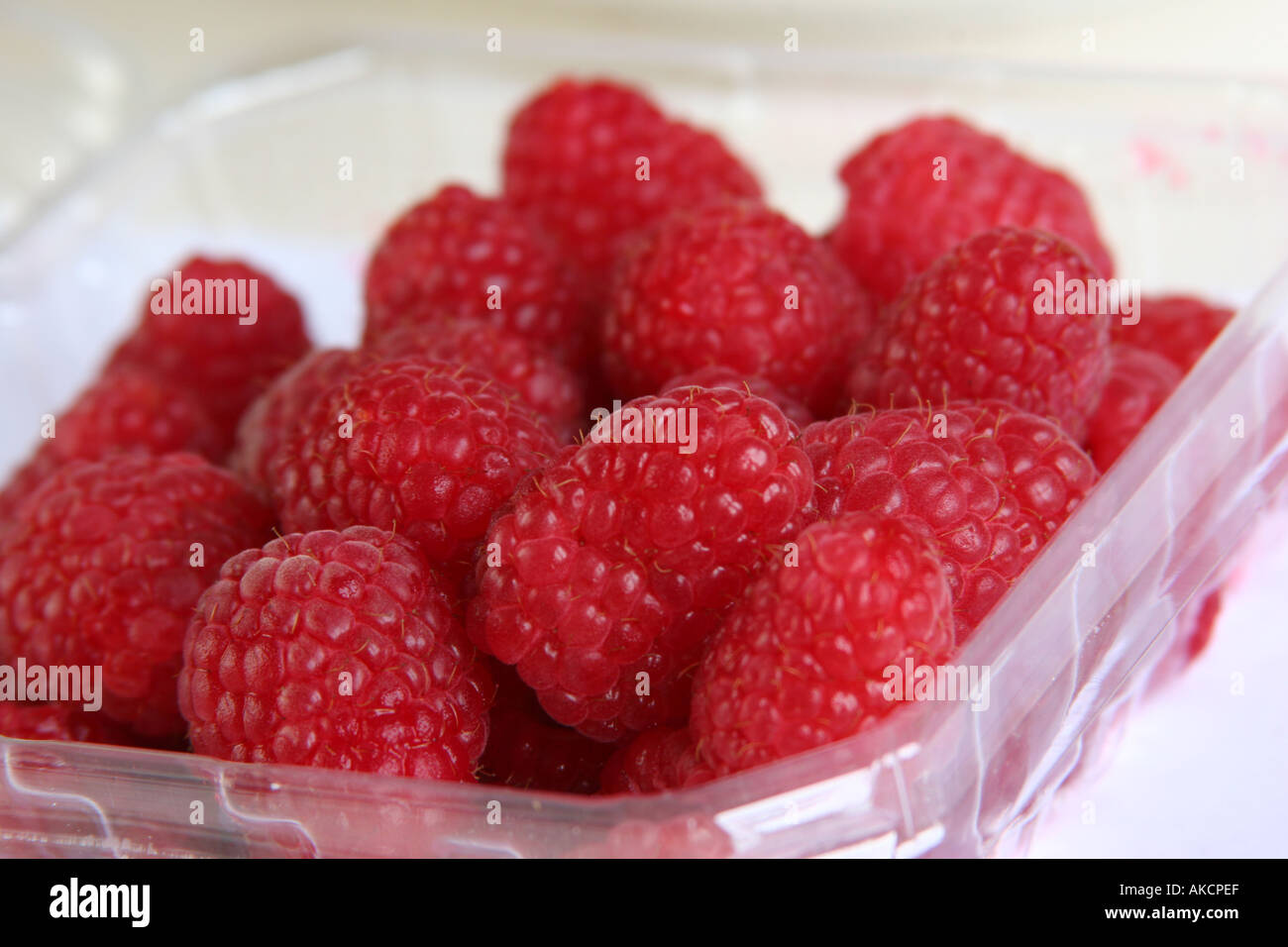 fresh scottish raspberies in plastic supermarket pack Stock Photo - Alamy