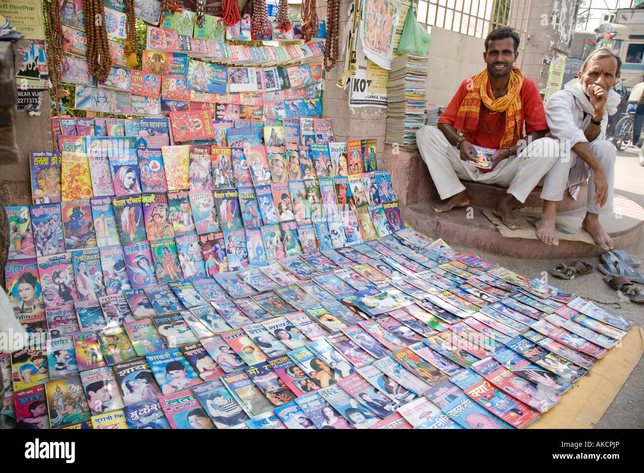 A street vendor selling magazines from his roadside stall. Varanasi ...