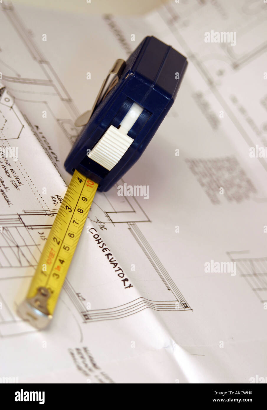 A Stock Photograph of a tape measure on architectural blueprints Stock ...