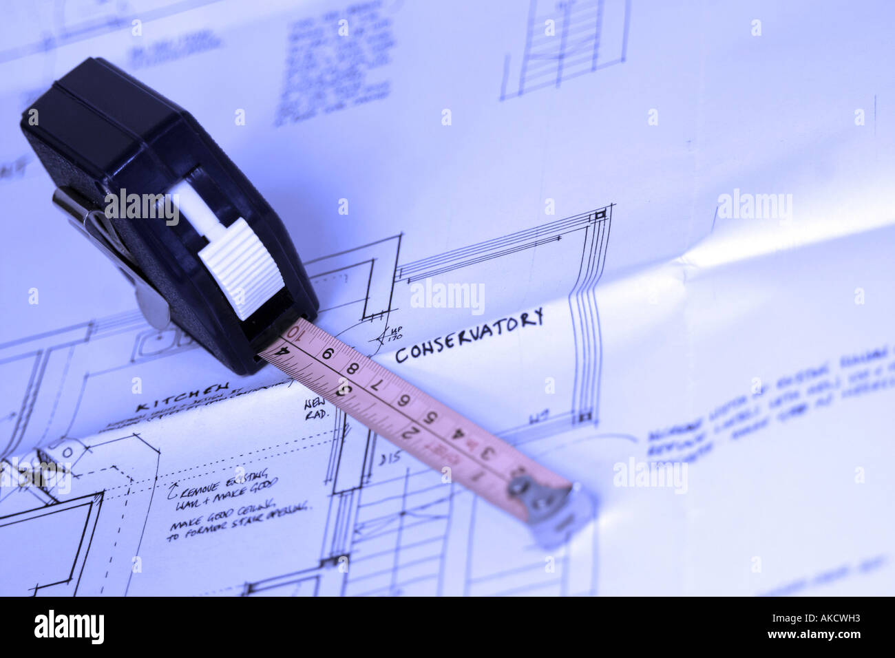 A Stock Photograph of a tape measure on architectural blueprints Stock ...
