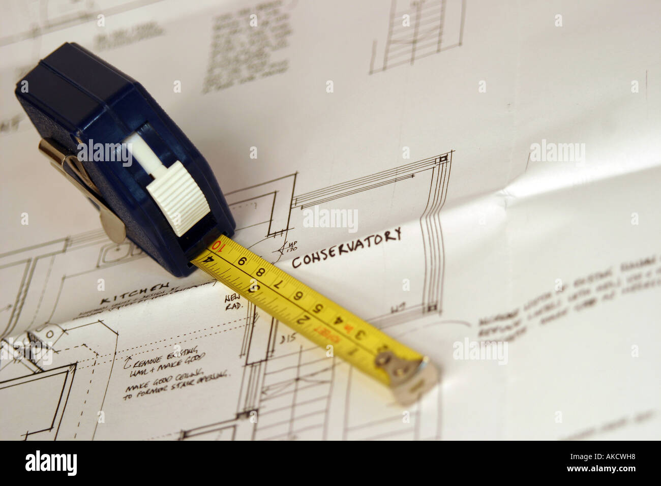 A Stock Photograph of a tape measure on architectural blueprints Stock ...