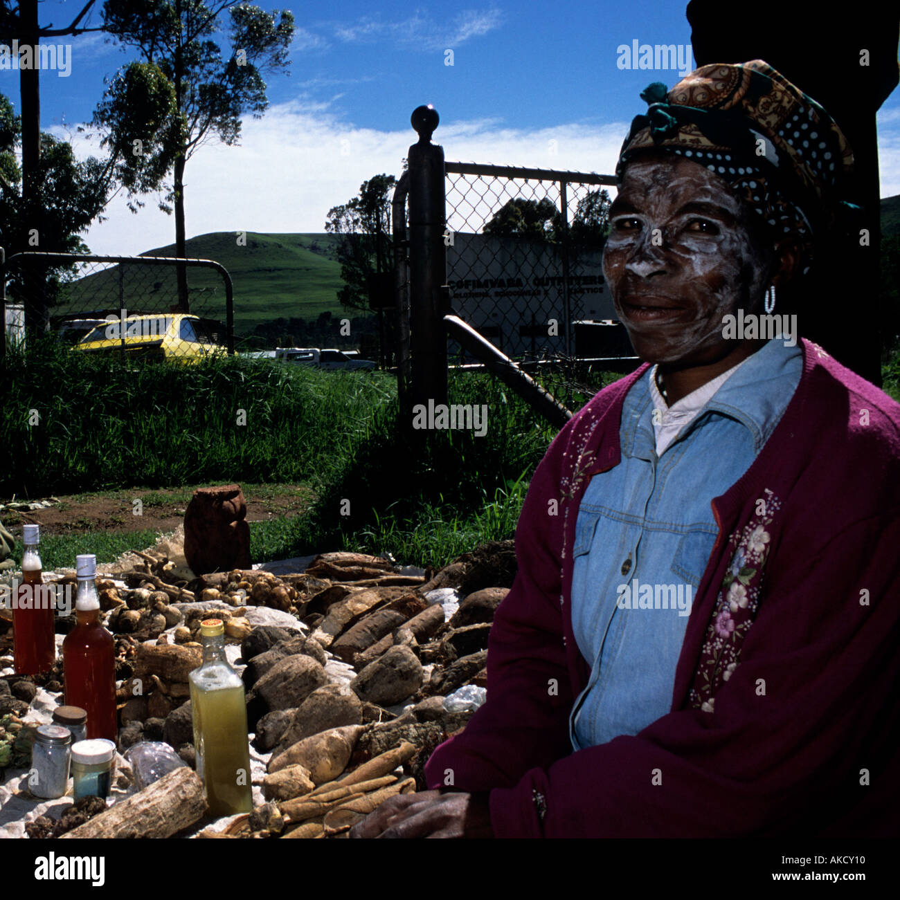 A local woman selling goods to tourists at a village in South Africa ...