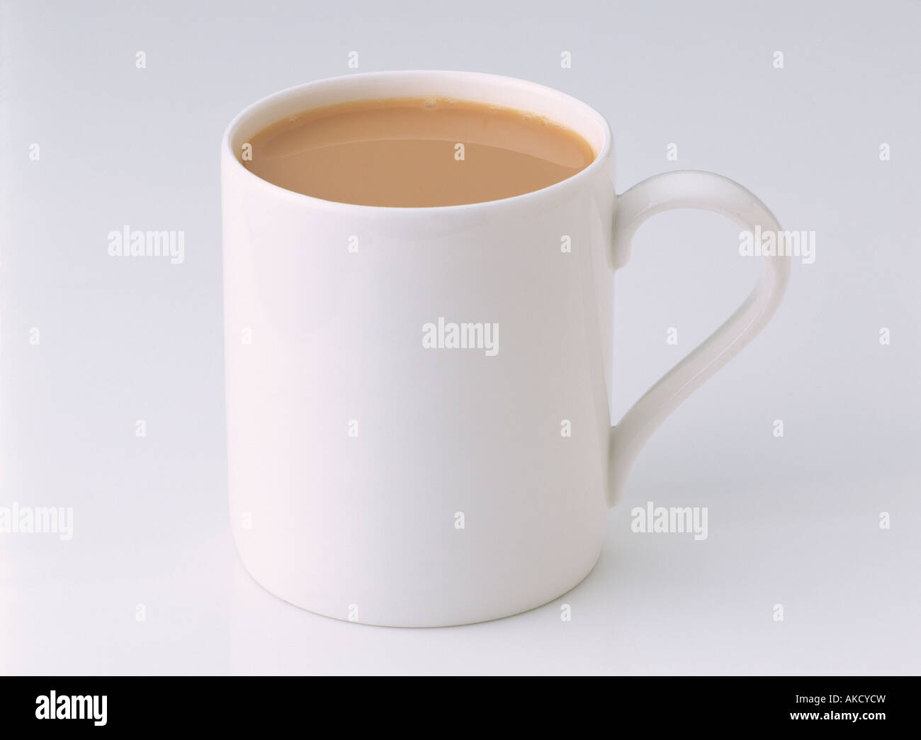 A white china mug of tea on a white background Stock Photo - Alamy