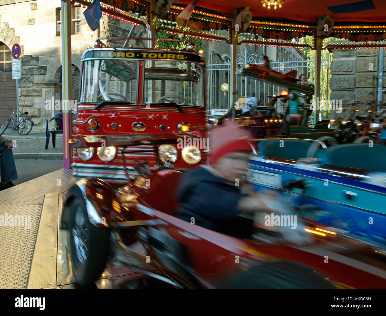 little child driving in a car of kids merry go round roundabout Stock ...