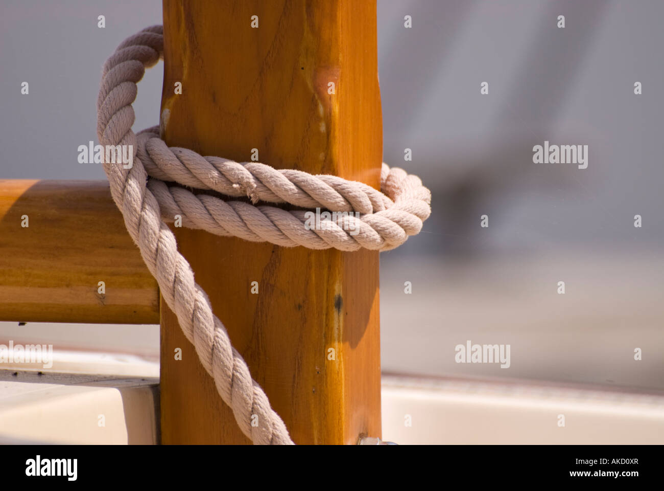 A Close Detail View Of A Rope Line Tied Lashed To Wooden Mast On A ...