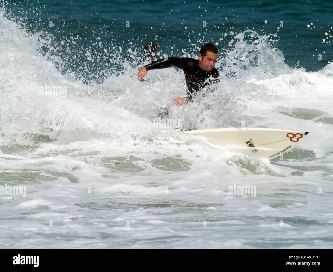Male surfer carving up a wave Stock Photo - Alamy