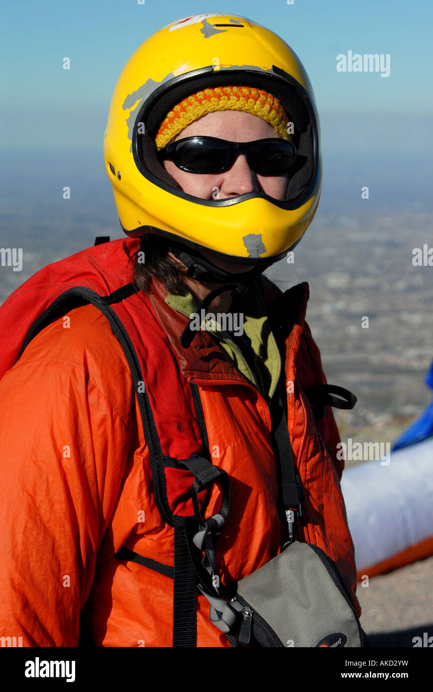 A woman stands ready to paraglide off of a hillside outside Mendoza ...
