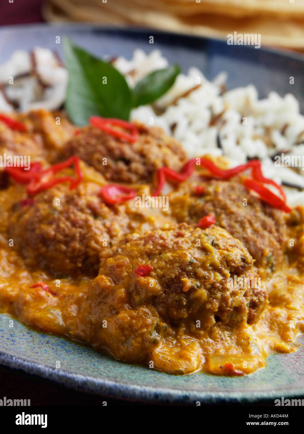 A plate of Goan meatballs and wild rice editorial food Stock Photo - Alamy