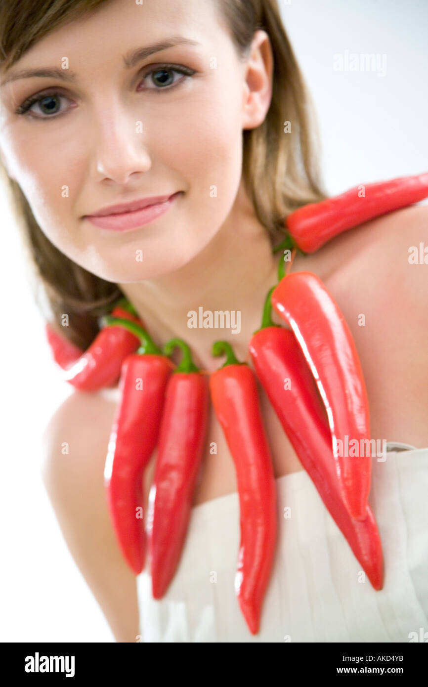 girl with chili peppers Stock Photo - Alamy