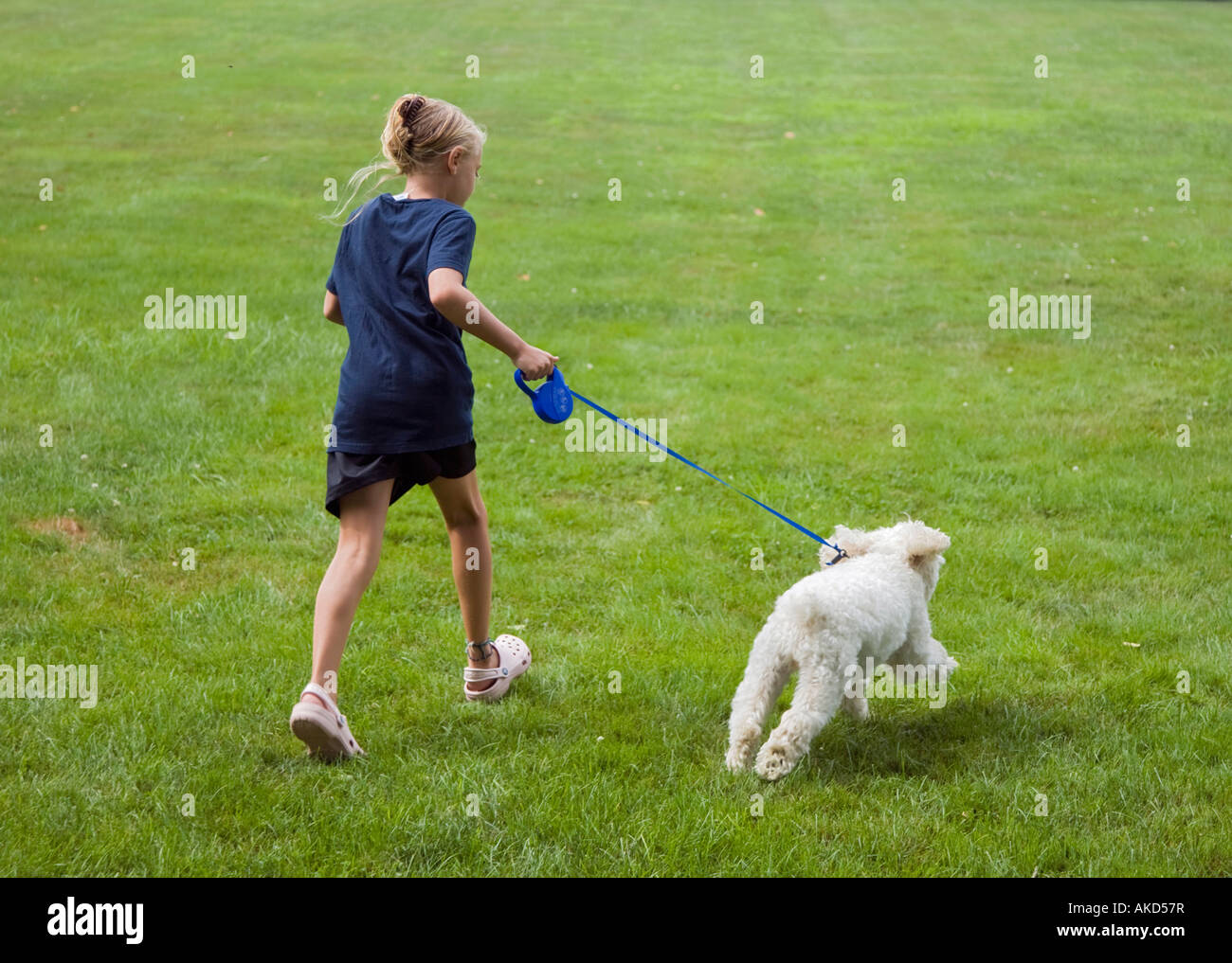 Dog and child running hi-res stock photography and images - Alamy