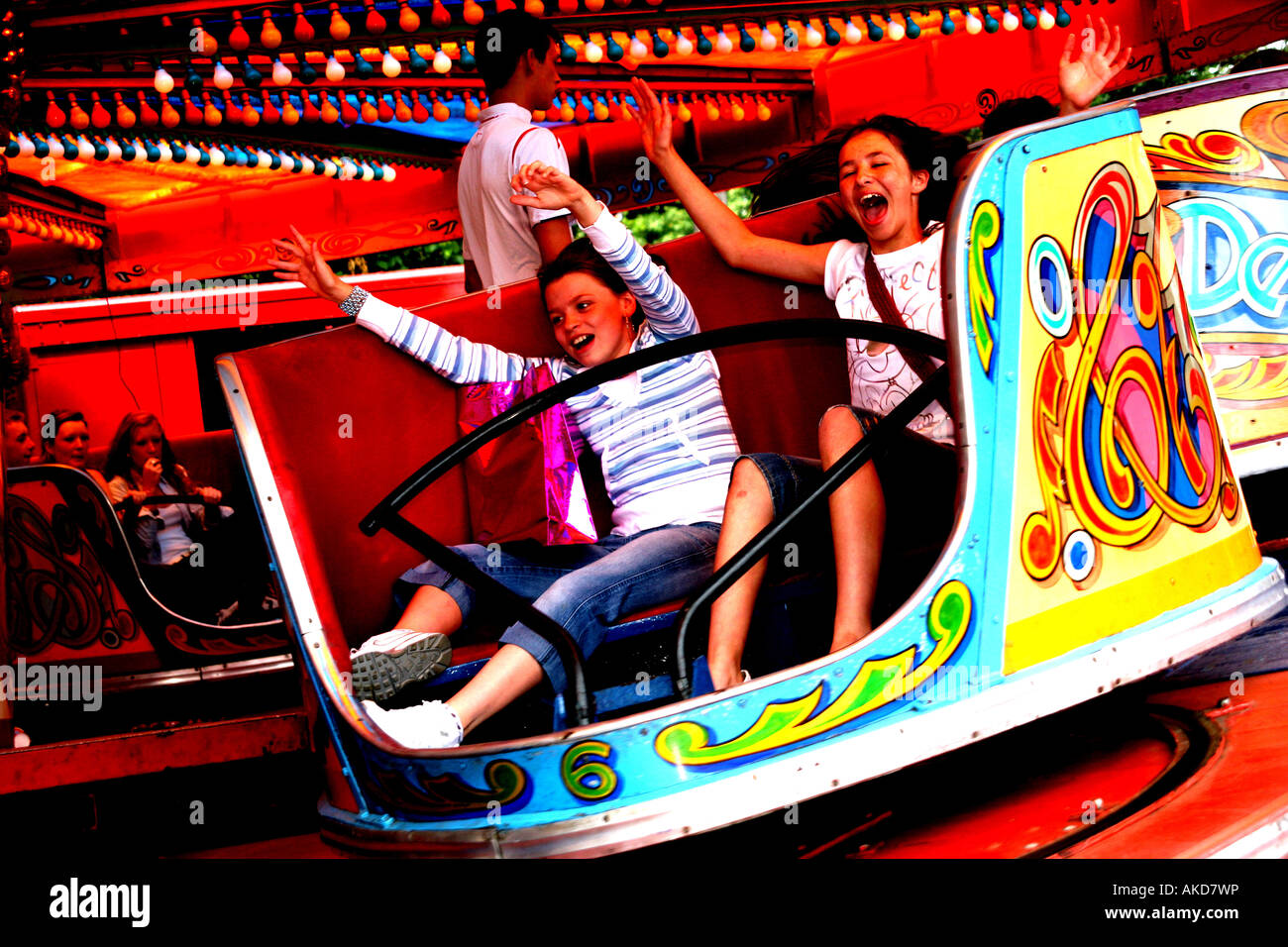 young girls enjoying a fairground ride Stock Photo - Alamy