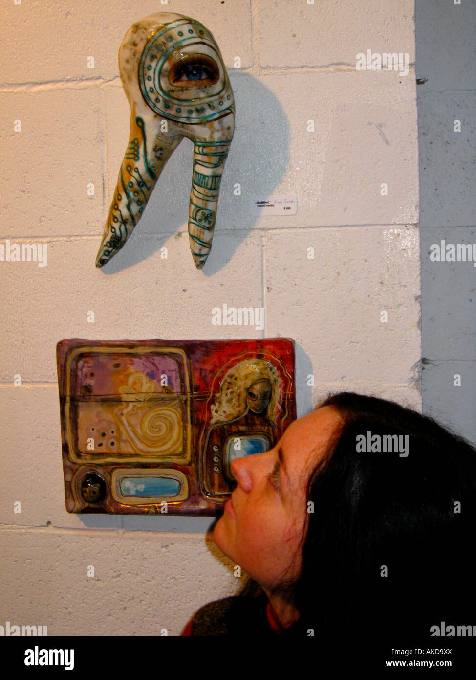Mixed media artist with two of her mixed media paper maché works Stock ...