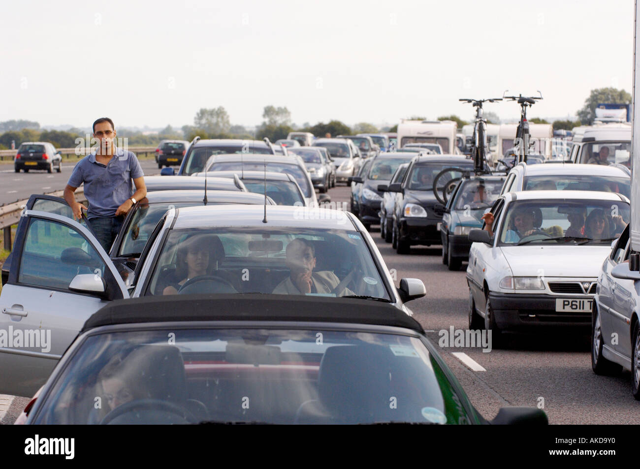 Major traffic jam on M5 motorway with drivers getting out of their cars ...