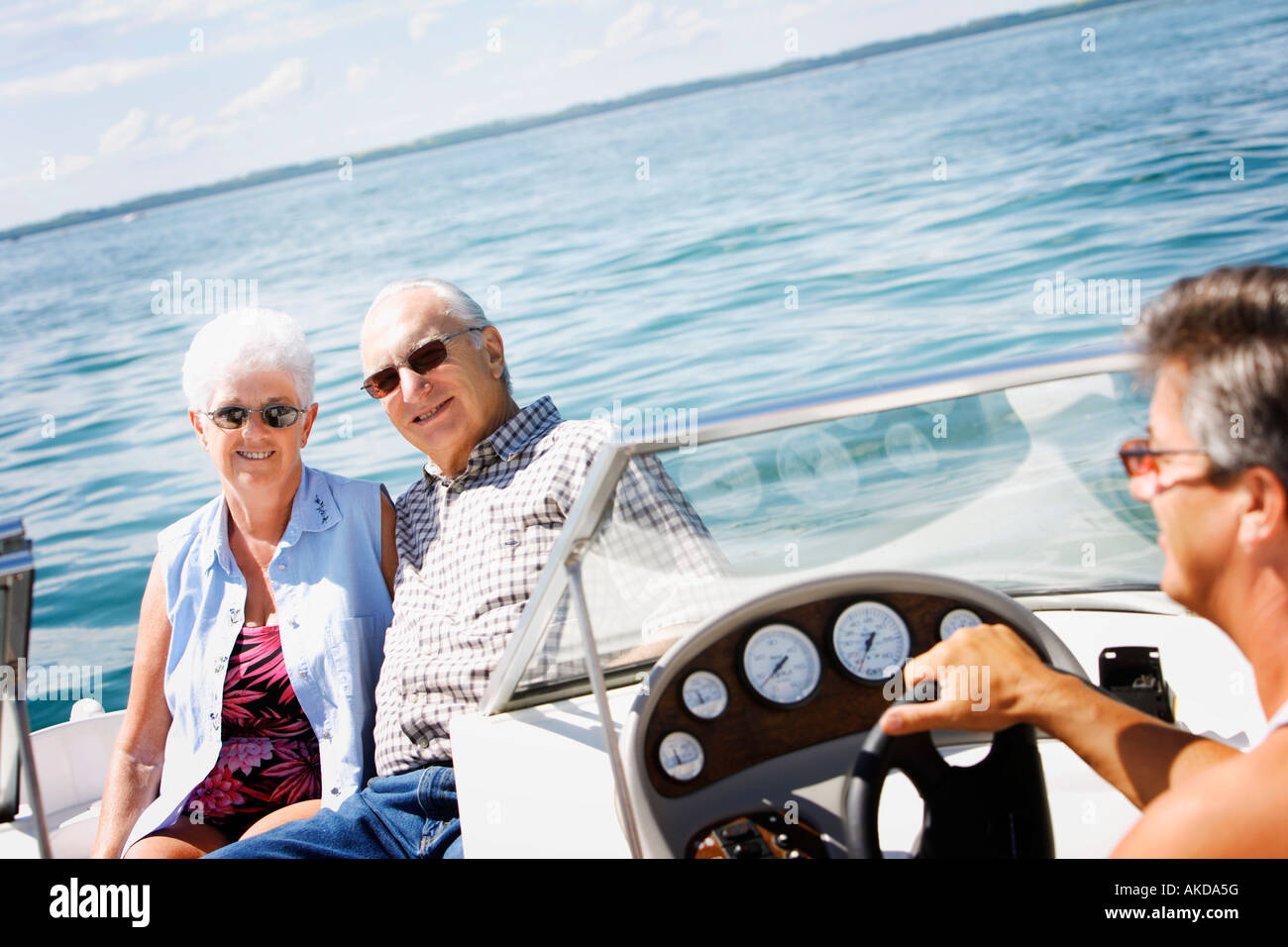 Senior woman in motorboat hi-res stock photography and images - Alamy