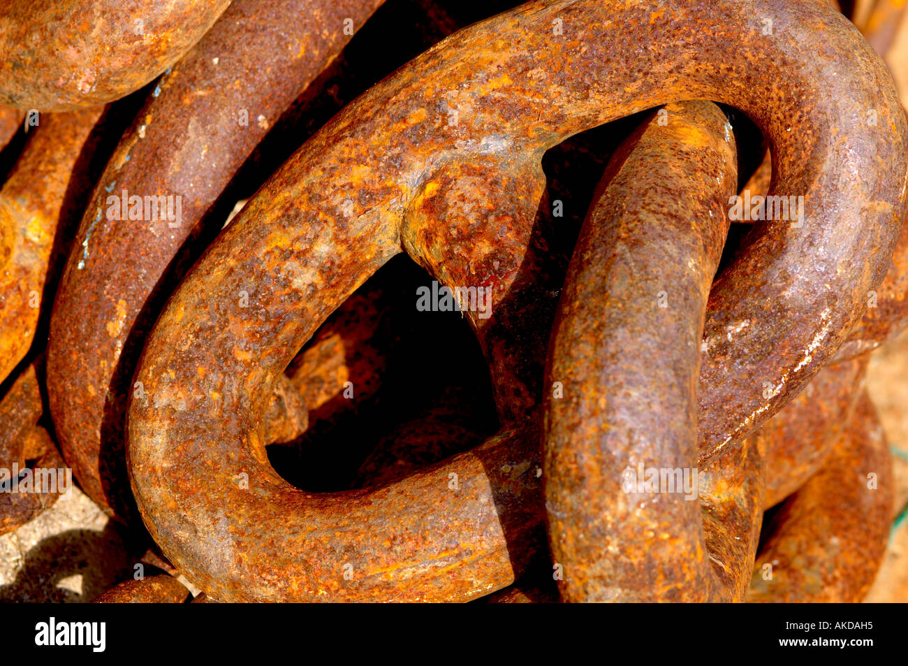 Rusty anchor chain in a UK harbour Stock Photo - Alamy