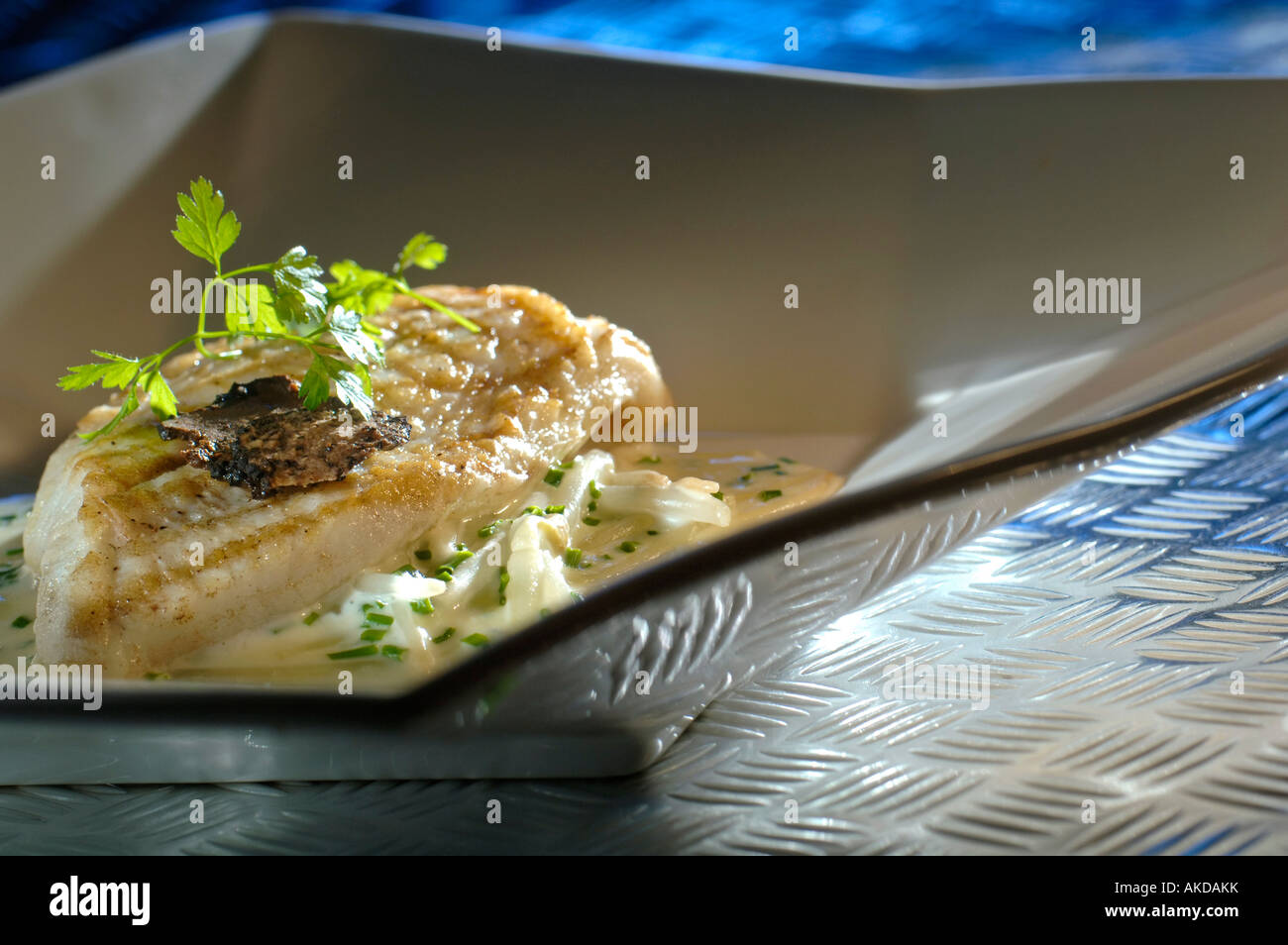 Baked fish with truffle Stock Photo - Alamy