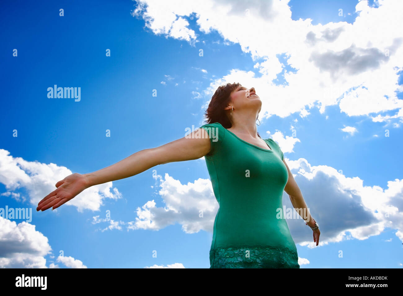 Woman with arms outstretched Stock Photo - Alamy