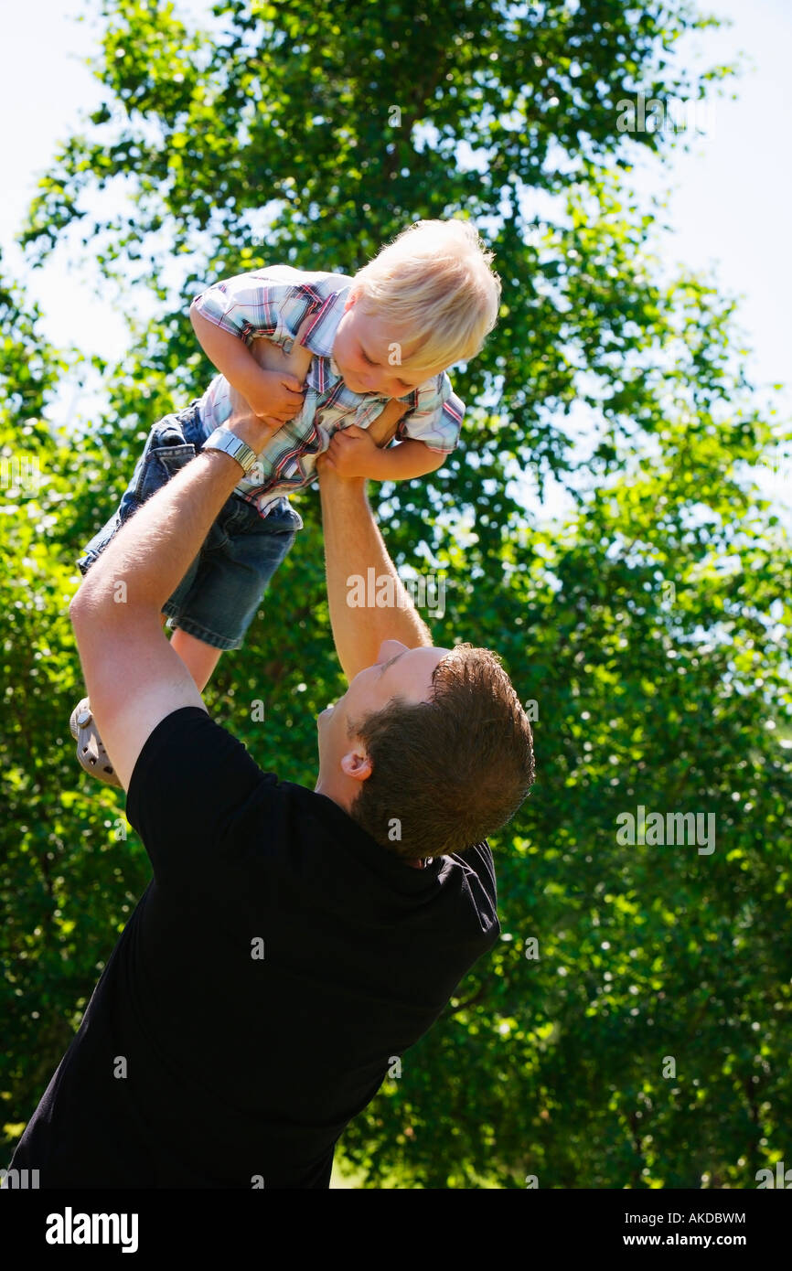 Man holding child Stock Photo - Alamy