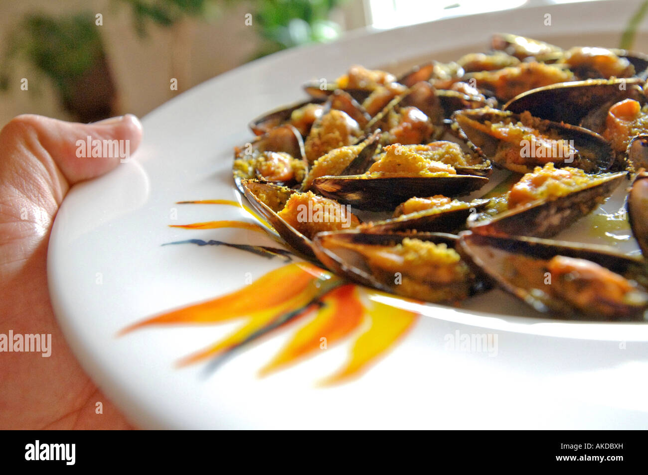 Spanish style grilled mussels Stock Photo - Alamy