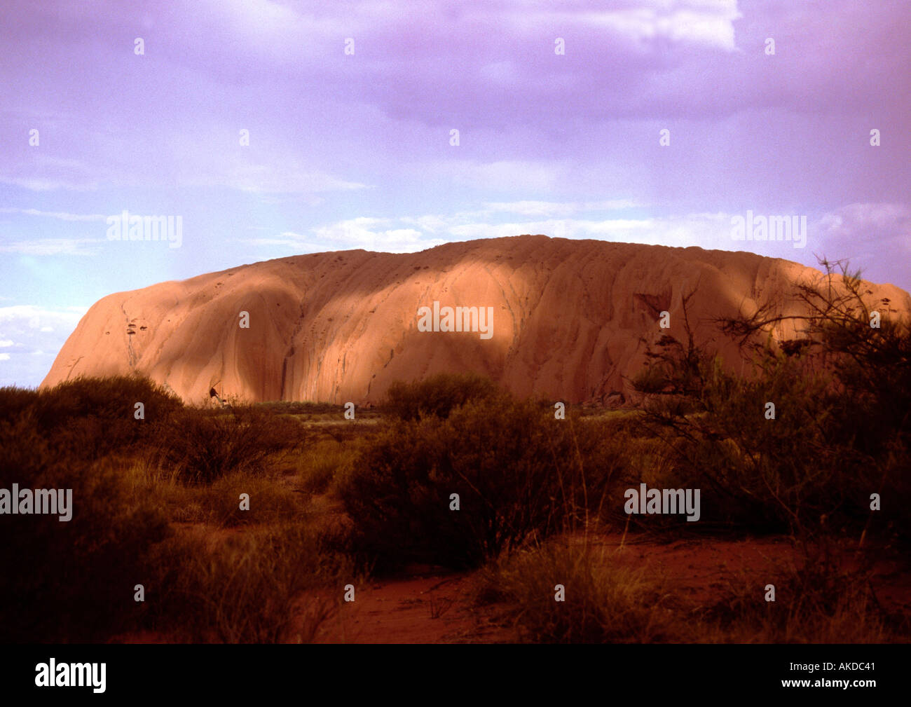 Cloud shadow over Uluru Ayers Rock NT Australia Stock Photo - Alamy