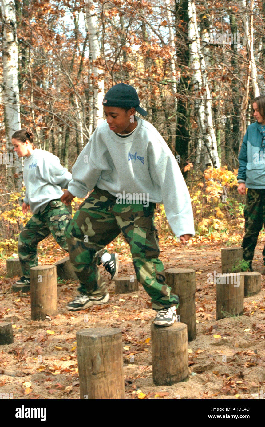 Multiethnic teens participating in obstacle course. Camp Ripley ...