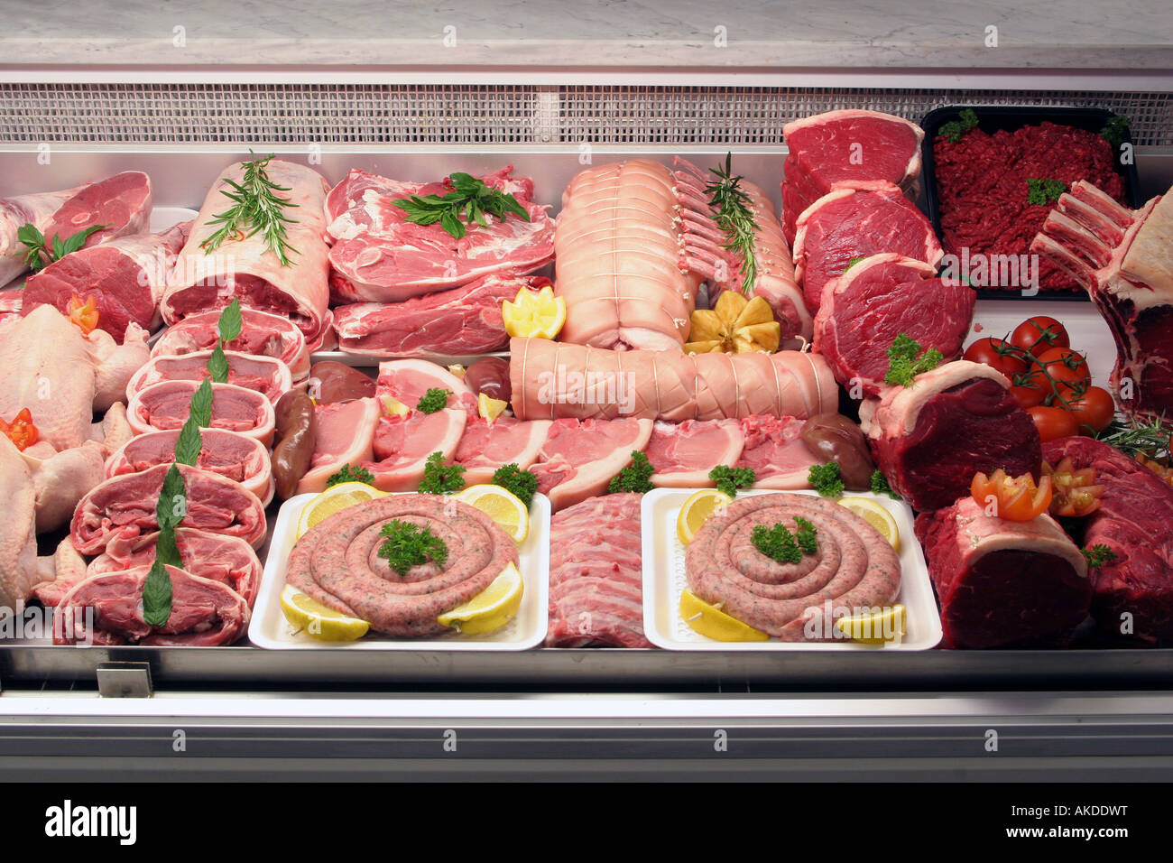 Meat on display at a butchers shop Stock Photo - Alamy