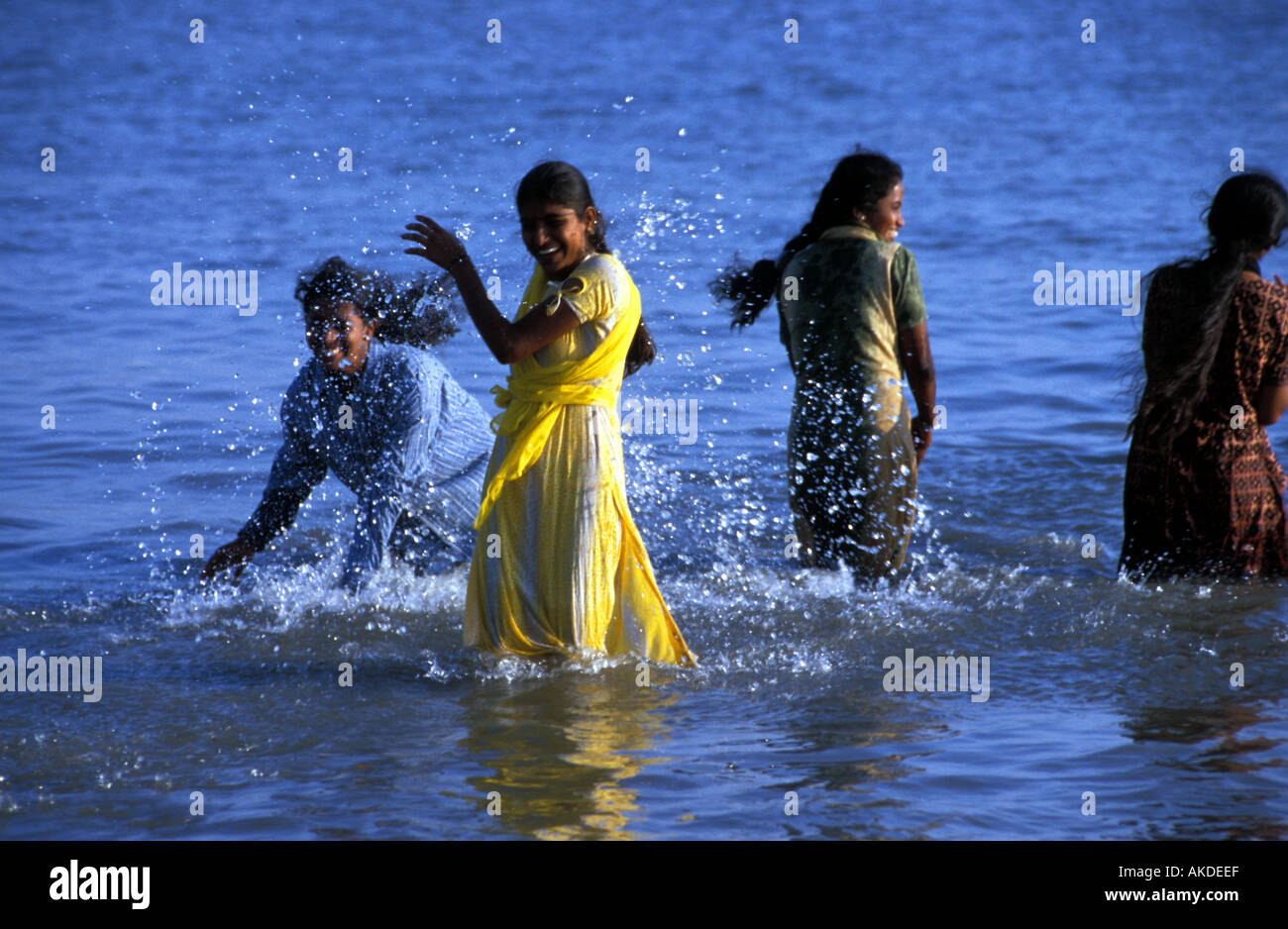 Gilrs play in the sea Chow Patty Beach India Stock Photo - Alamy