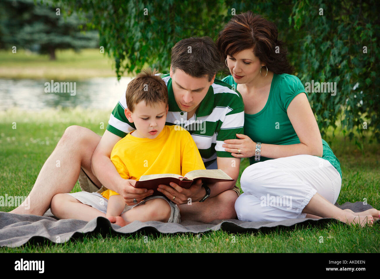 Father and son reading bible hi-res stock photography and images - Alamy