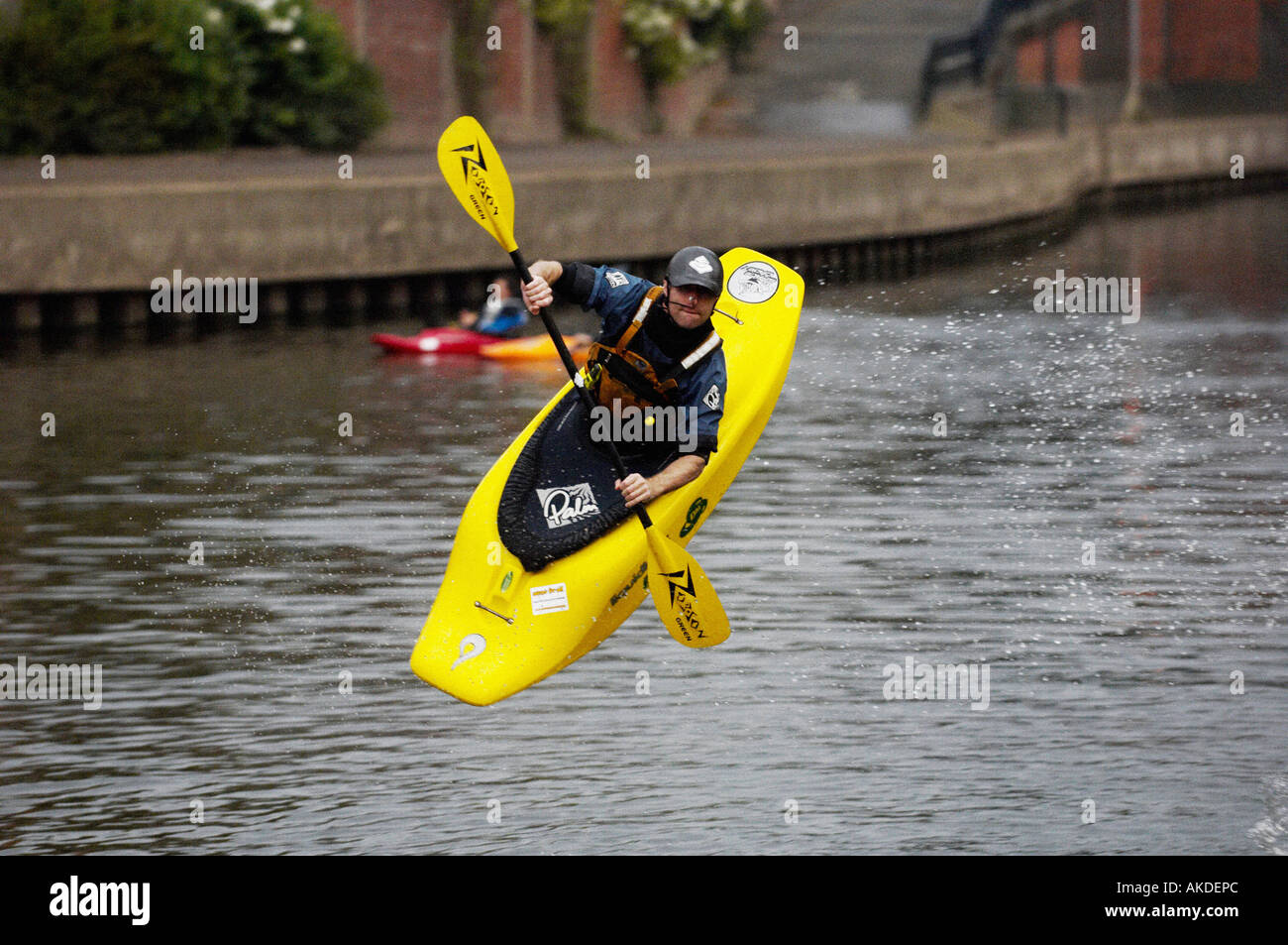 Airborne Kayak flying off the end of a water ramp into the river Foss ...