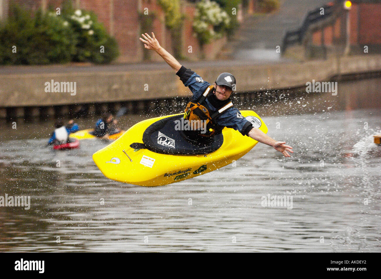 Airborne Kayak flying off the end of a water ramp into the river Foss ...