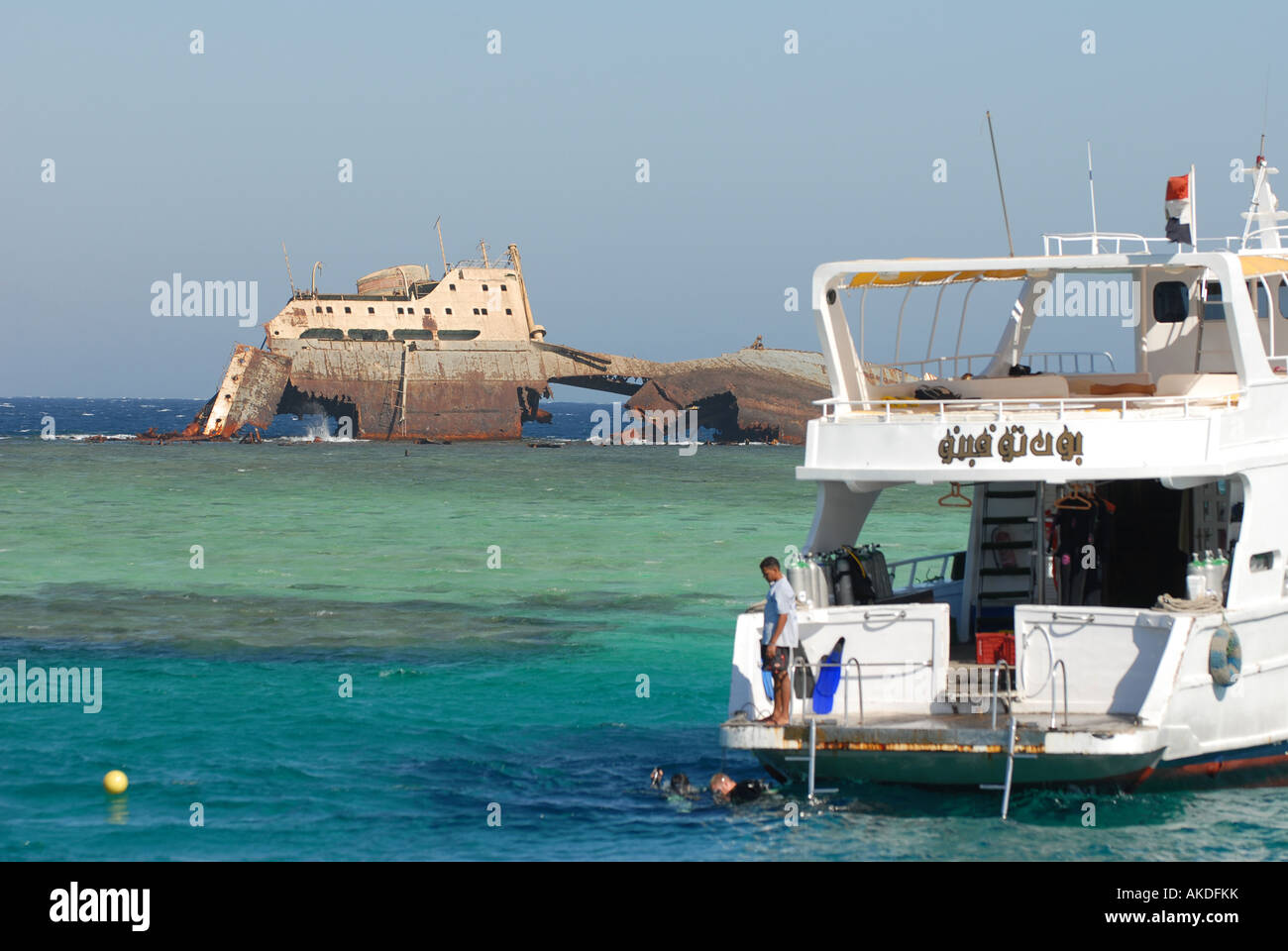 A tour boat at Jackson'r reef Sharm el Sheik Egypt with a wreck in the ...