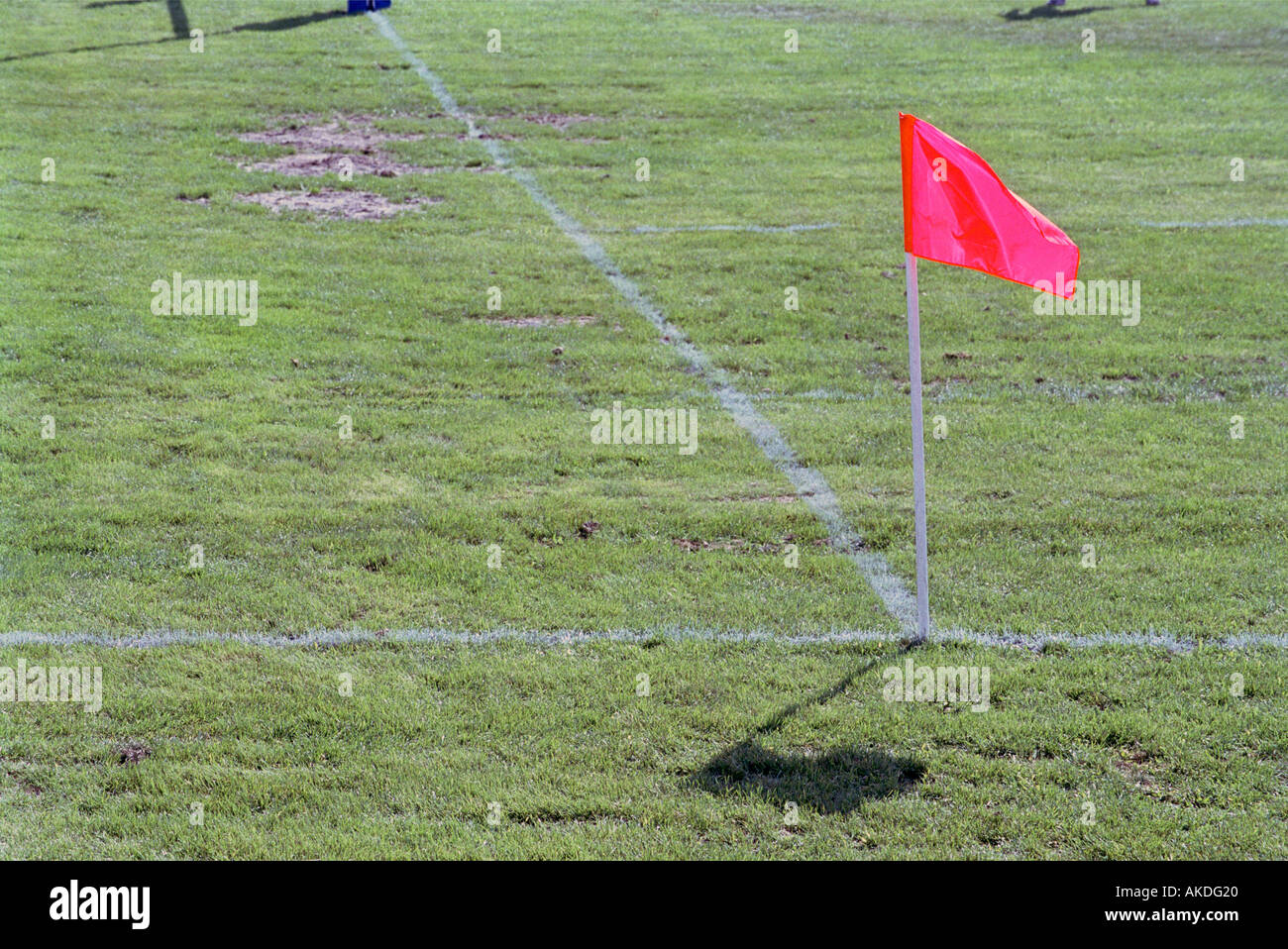 red flag waving in the wind on sports field Stock Photo - Alamy