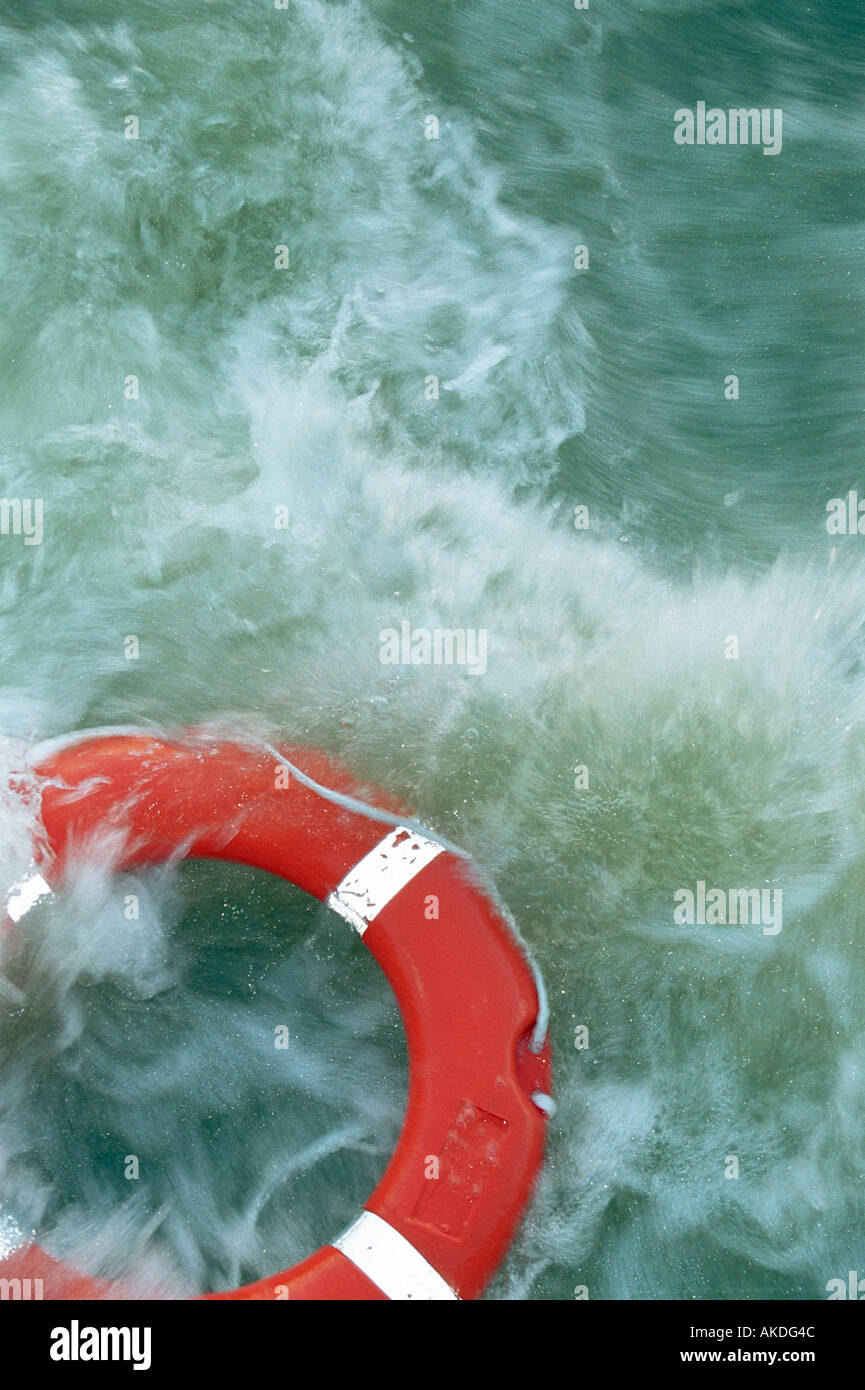 orange life saving rubber ring in a rough sea Stock Photo - Alamy