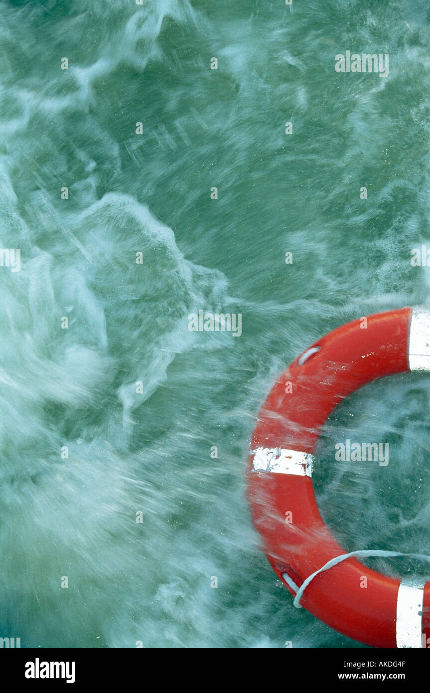 orange life saving rubber ring in a rough sea Stock Photo - Alamy